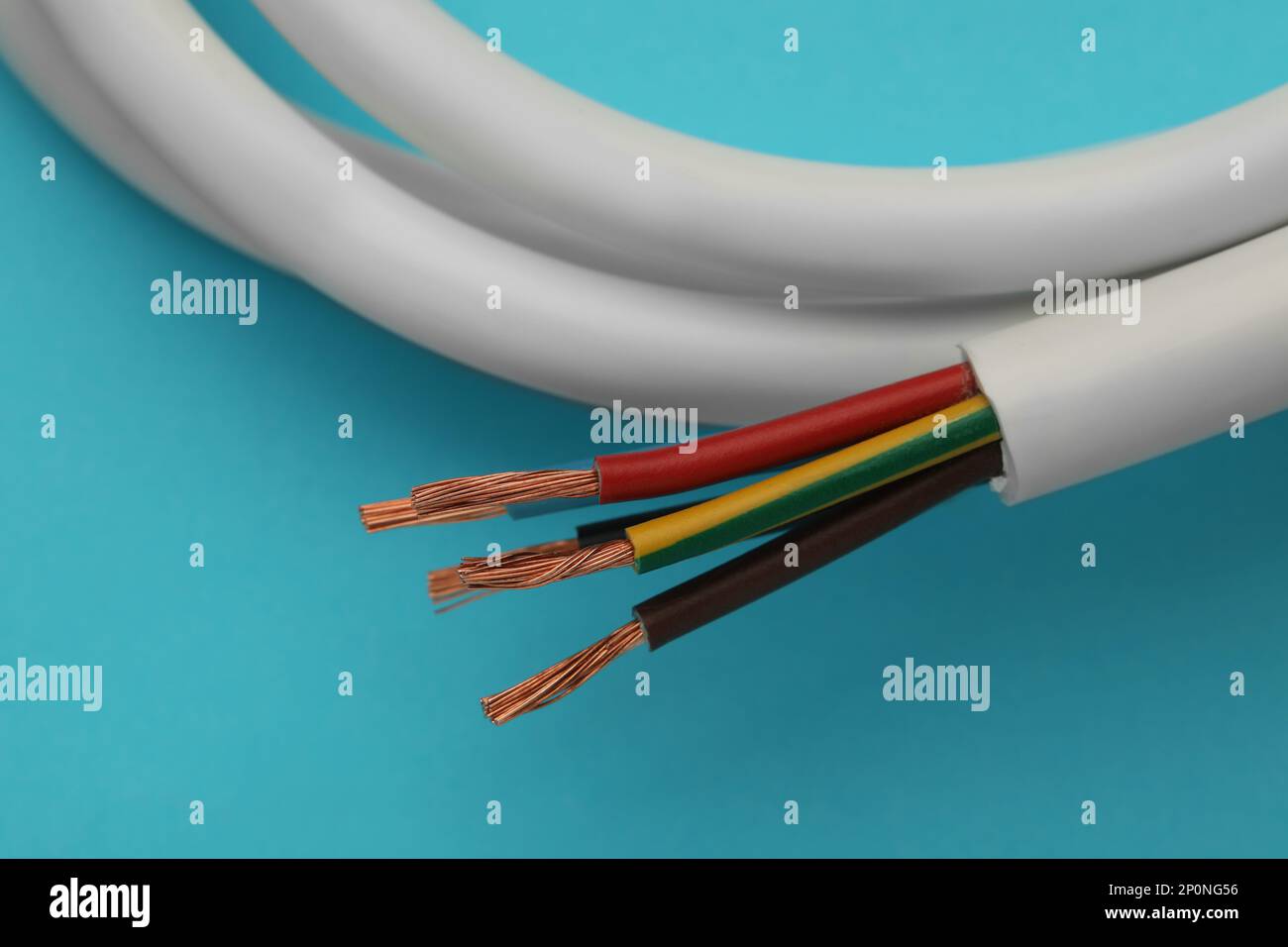 Electrical wires on light blue background, closeup Stock Photo - Alamy