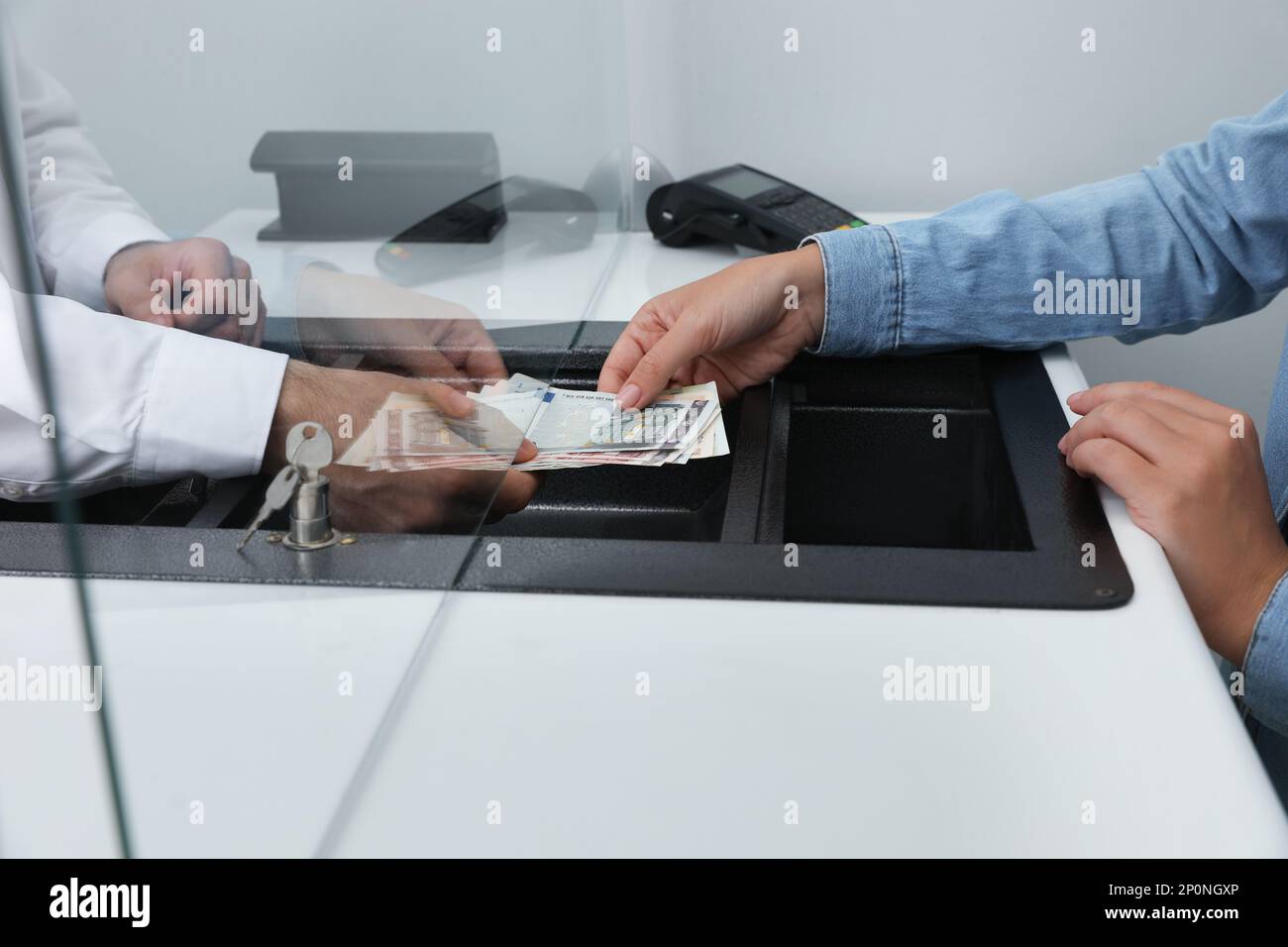 Woman giving money to cashier in bank, closeup. Currency exchange Stock ...