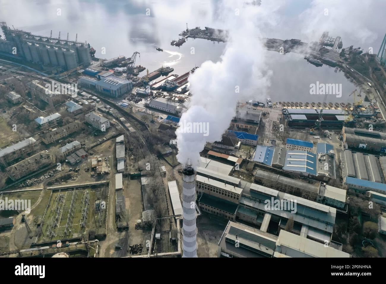 Polluting air with smoke, aerial view of industrial factory. CO2 ...