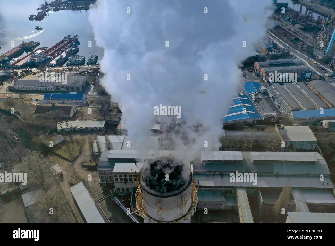 Polluting air with smoke, aerial view of industrial factory. CO2 ...