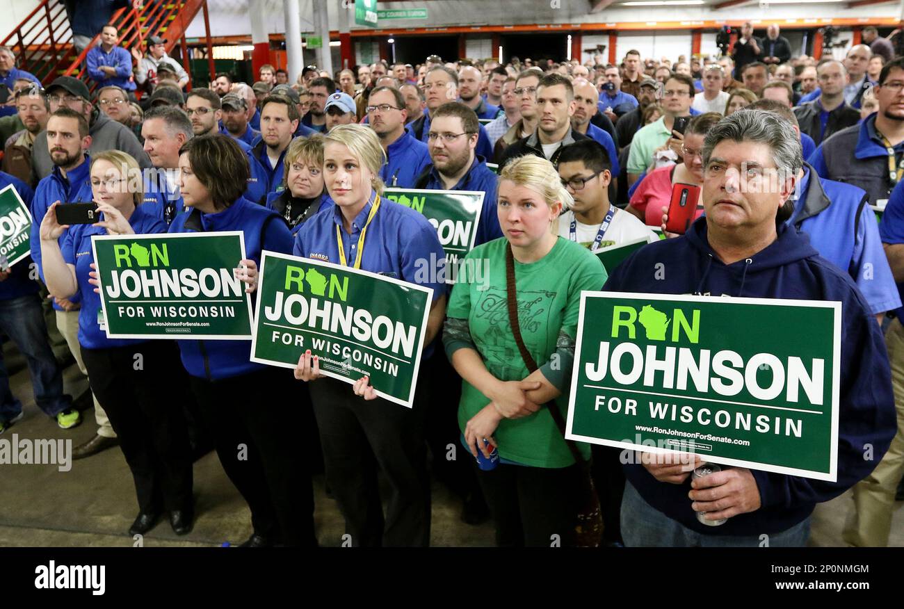 Employees hold signs in support of Wisconsin Sen. Ron Johnson as they ...
