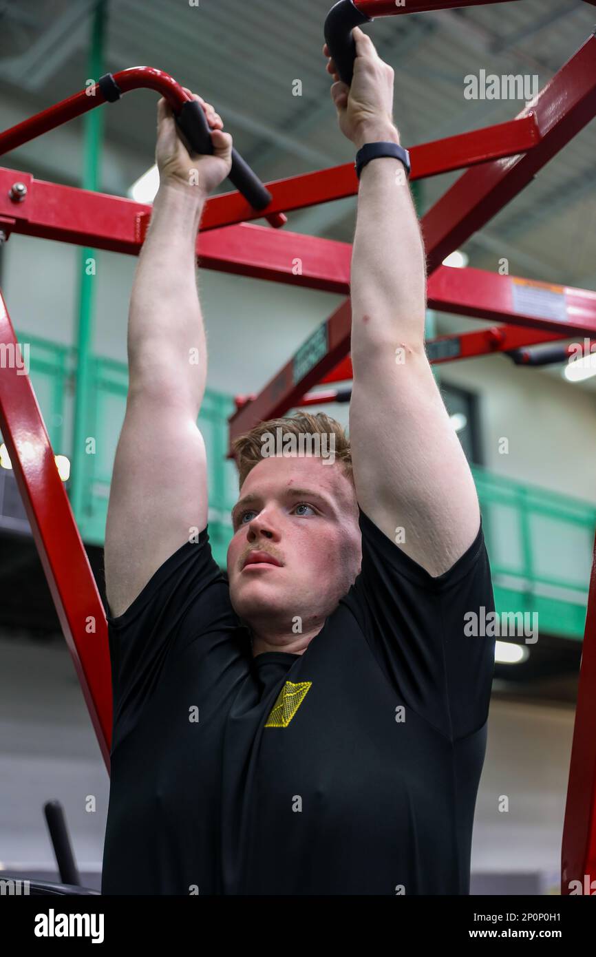 A U.S. Army Soldier assigned to the 1st Infantry Division hangs from a ...