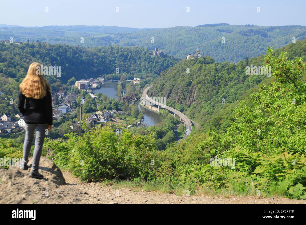 A woman is looking to the village Lahnstein, the Lahn and in background ...