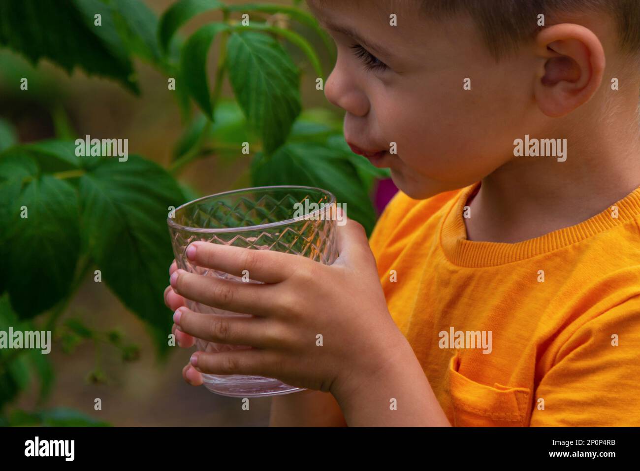 Happy child drinks fruit juice hi-res stock photography and images - Alamy
