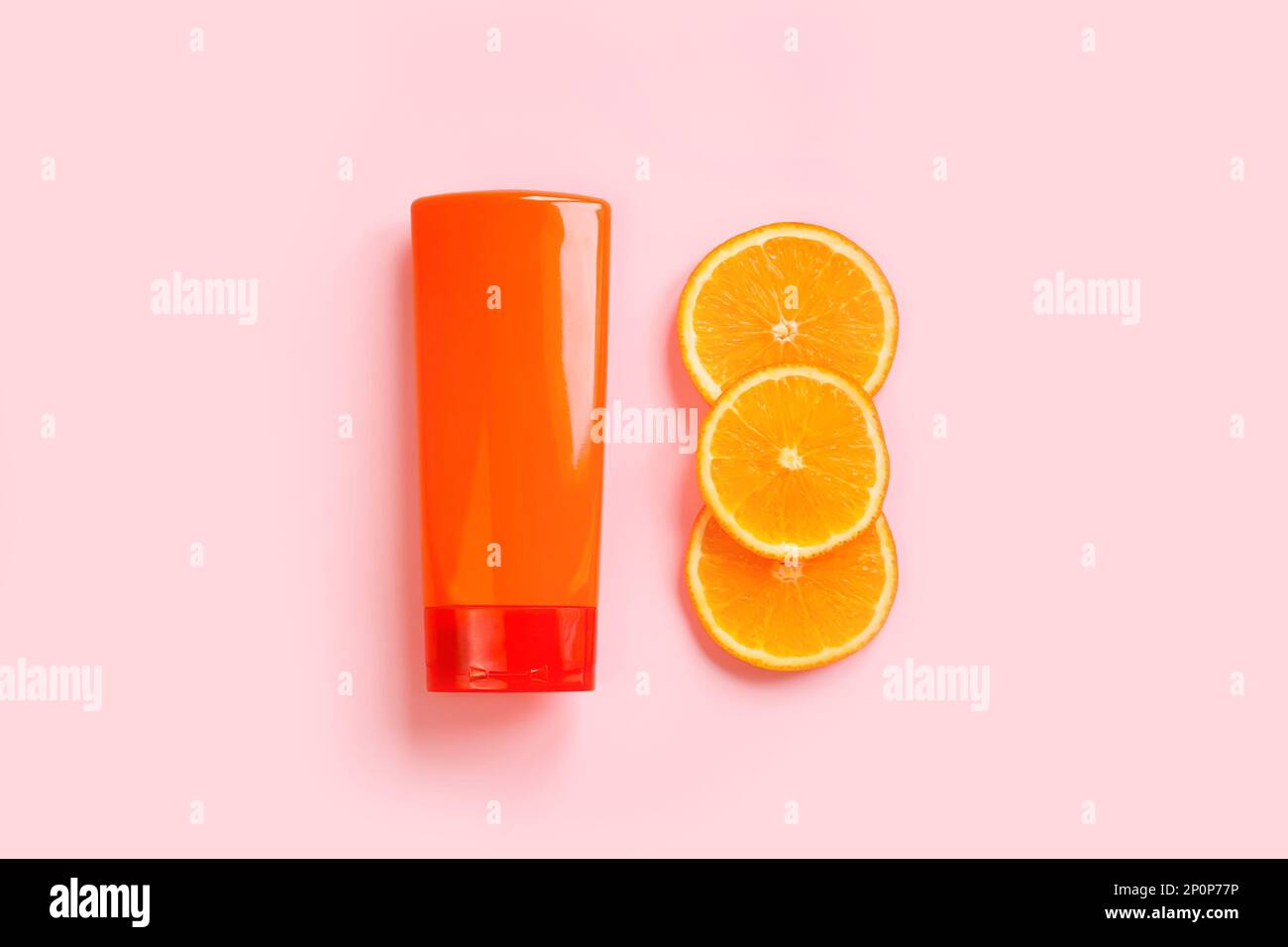 Mockup of unbranded orange shampoo or conditioner bottle for branding ...
