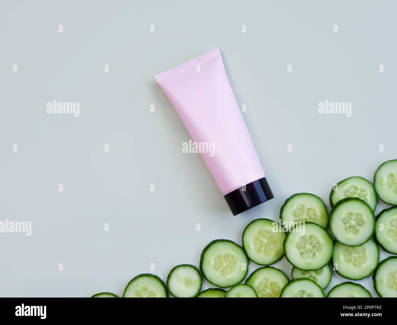 Light pink squeeze bottle plastic tube with black cap and fresh ...