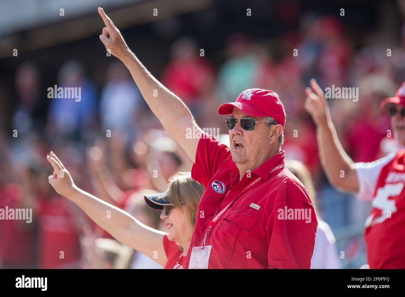 October 29, 2016: A Houston Cougars fan holds up the cougar paw hand ...