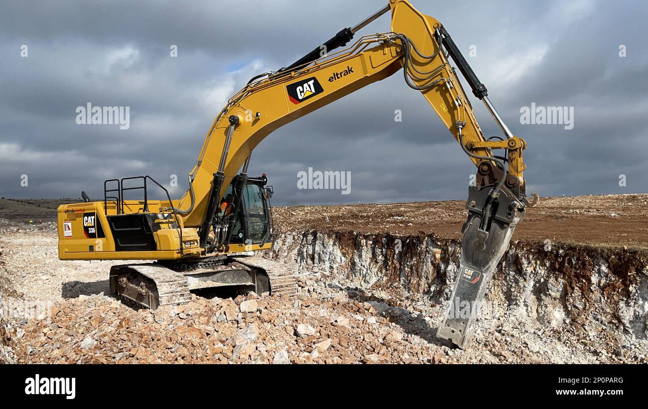 Excavator With Hydraulic Hammer Working At Huge Mining Site Stock Photo ...