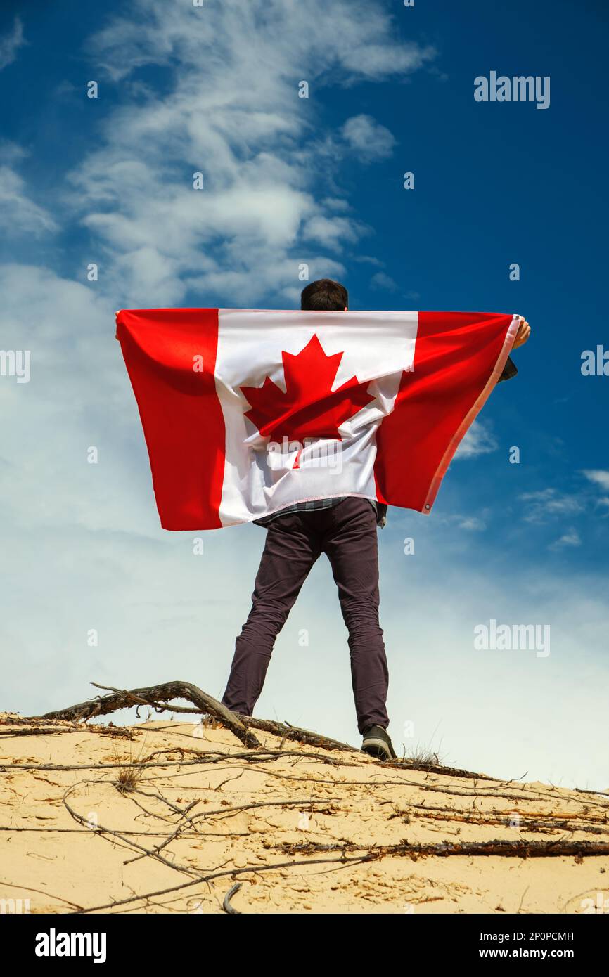 Canadian man holding canadian flag hi-res stock photography and images ...