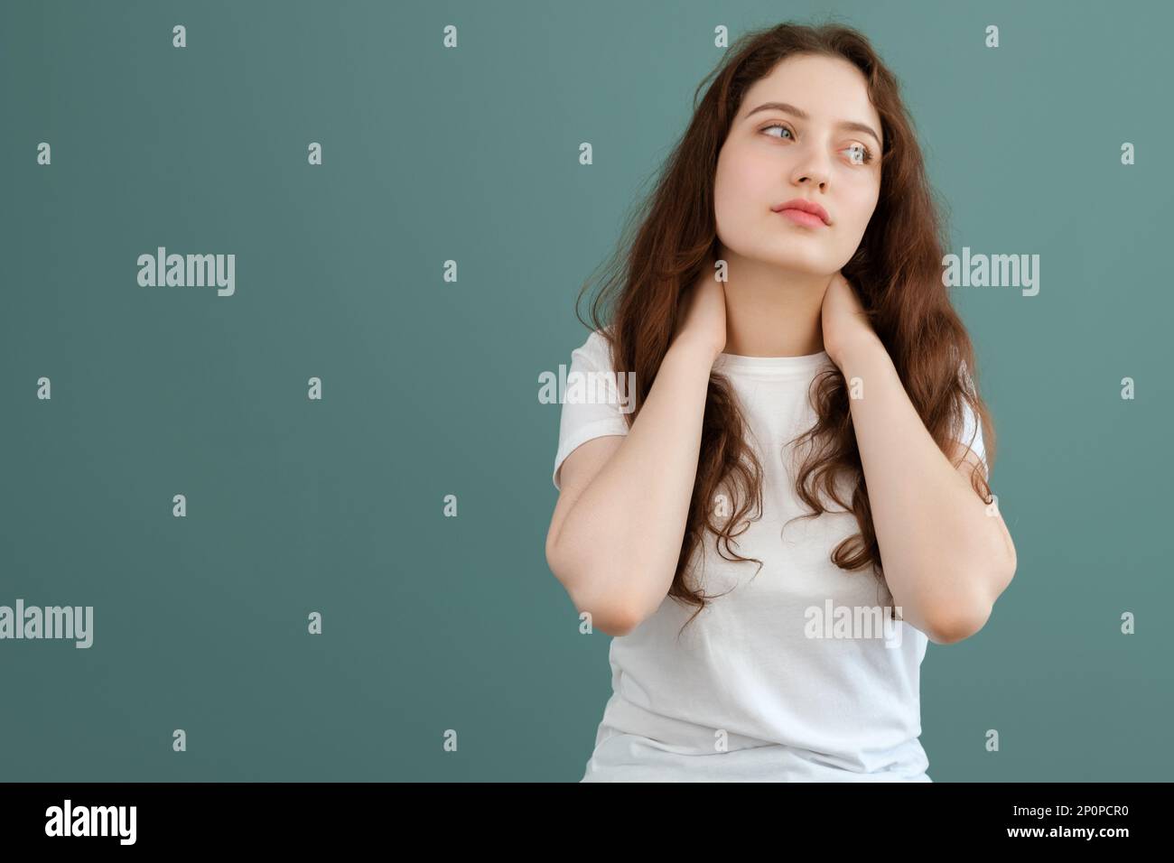 Teenage girl is tired, desperate, stressed or depressed, looking away ...