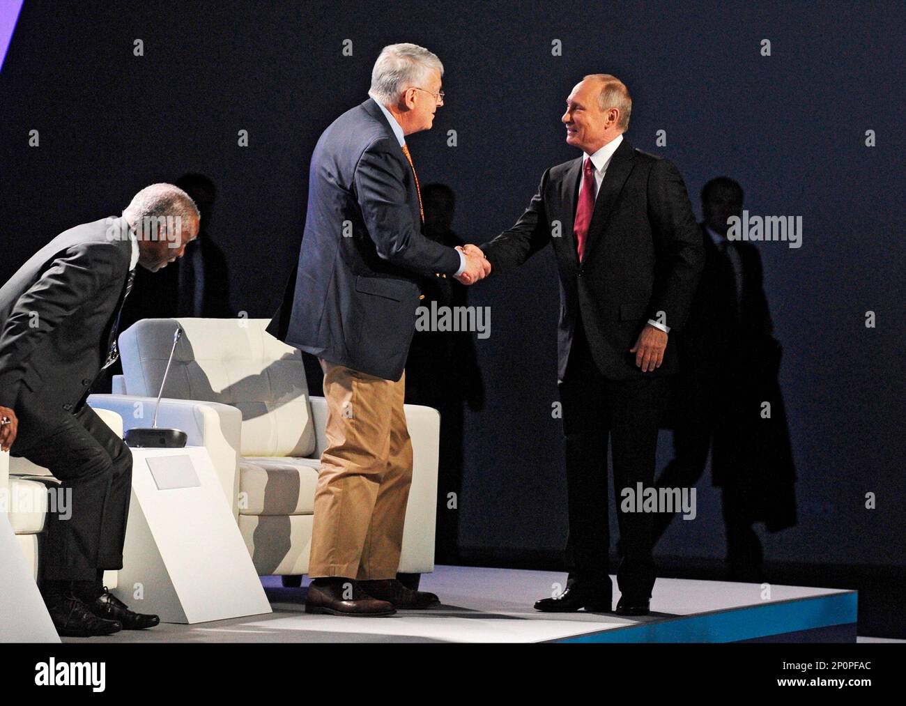 Russian President Vladimir Putin, right, greets Chair of the Governmnet ...