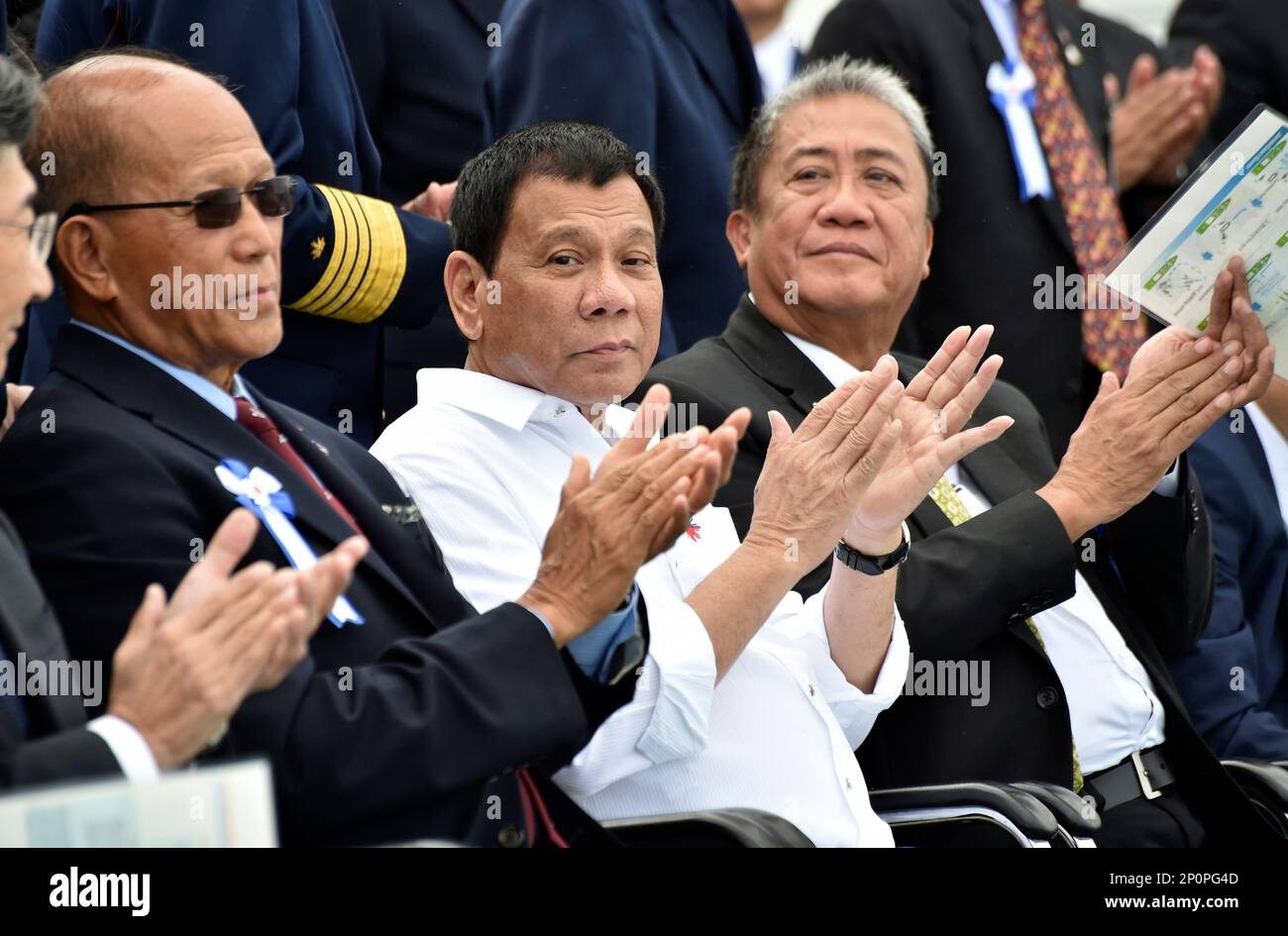 Philippine President Rodrigo Duterte, center, accompanied by ...