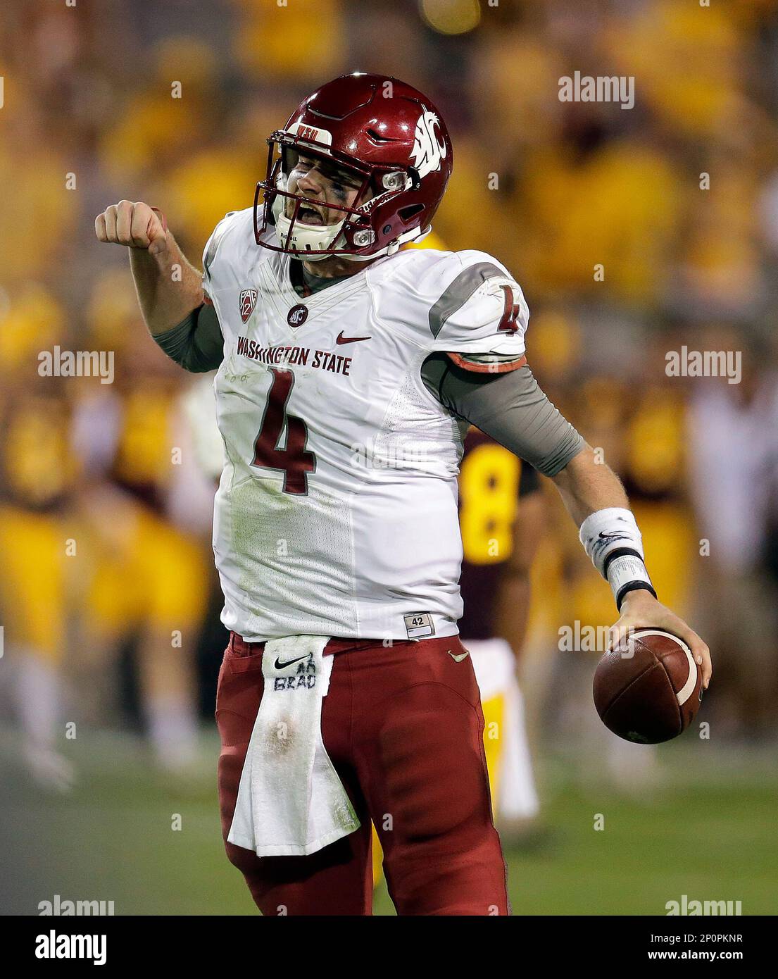 Washington State quarterback Luke Falk (4) reacts after defeating ...