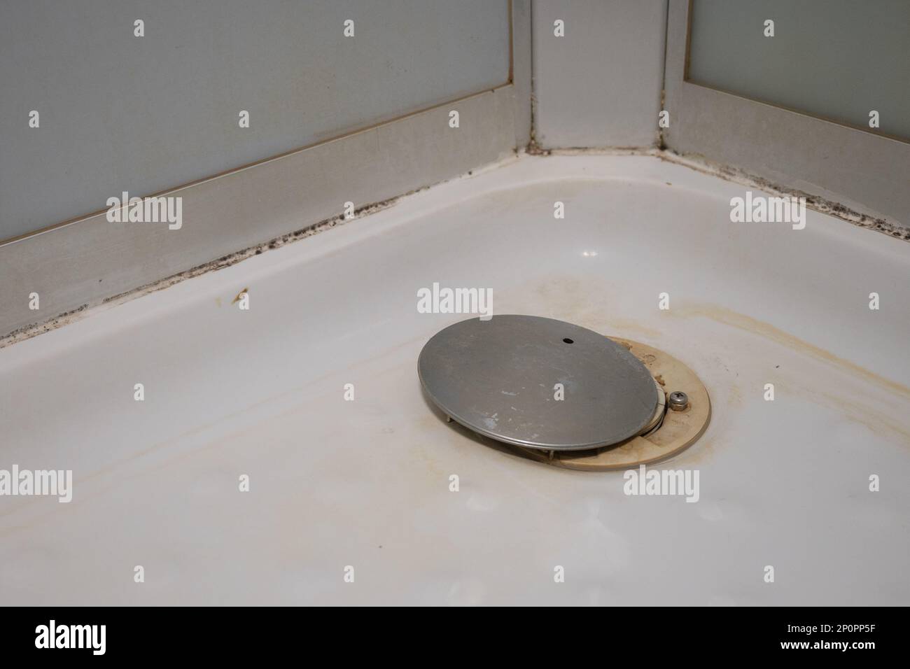 Broken drain cover in the shower cabin Stock Photo - Alamy