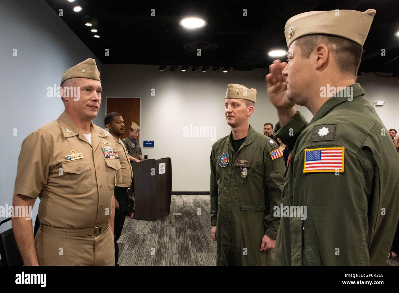 HOUSTON, Tx (February 03, 2023) Cmdr. Nicholas Weideman (right) renders ...