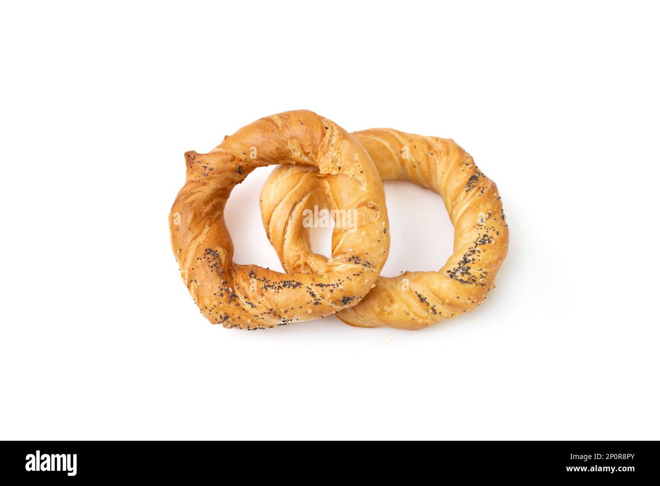 Pair of two pretzels with poppy seeds, close up isolated on white ...