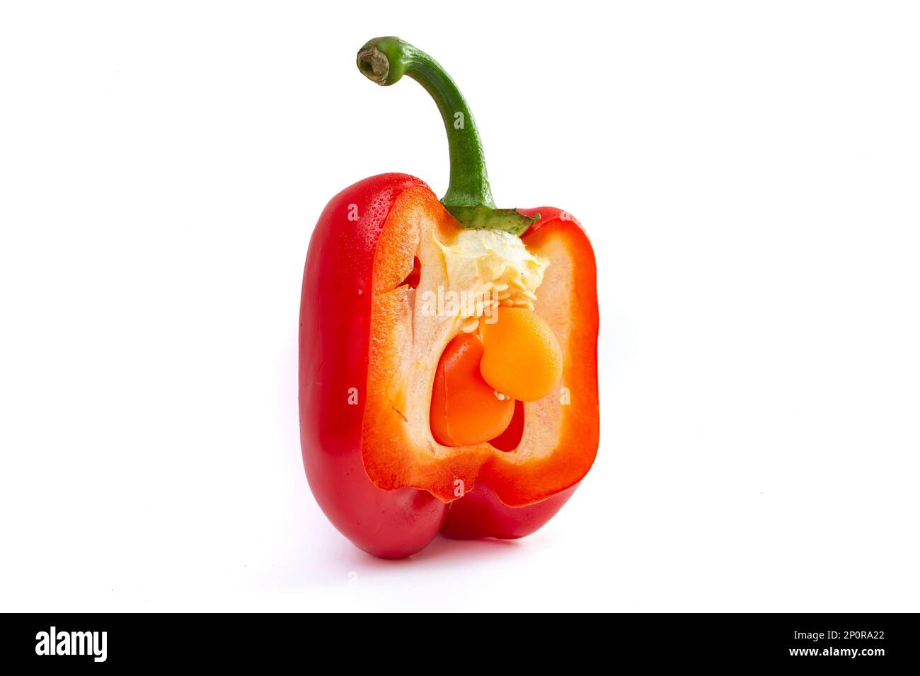 baby bell pepper inside a cross sectioned pepper, isolated on white ...