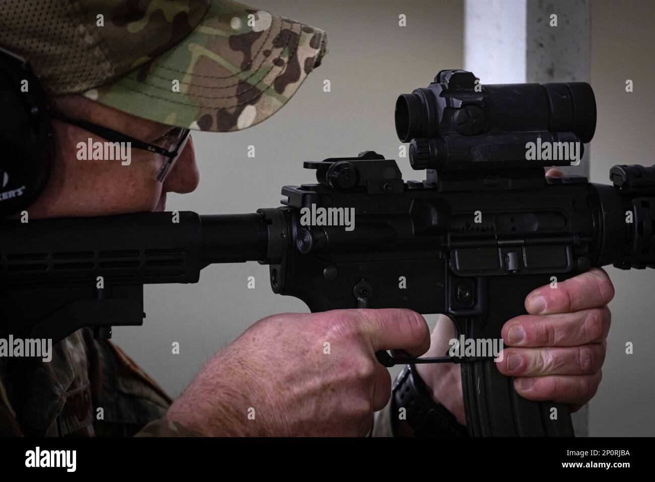 U.S. Air Force Maj. Chip Blackledge fires the M4 carbine during ...