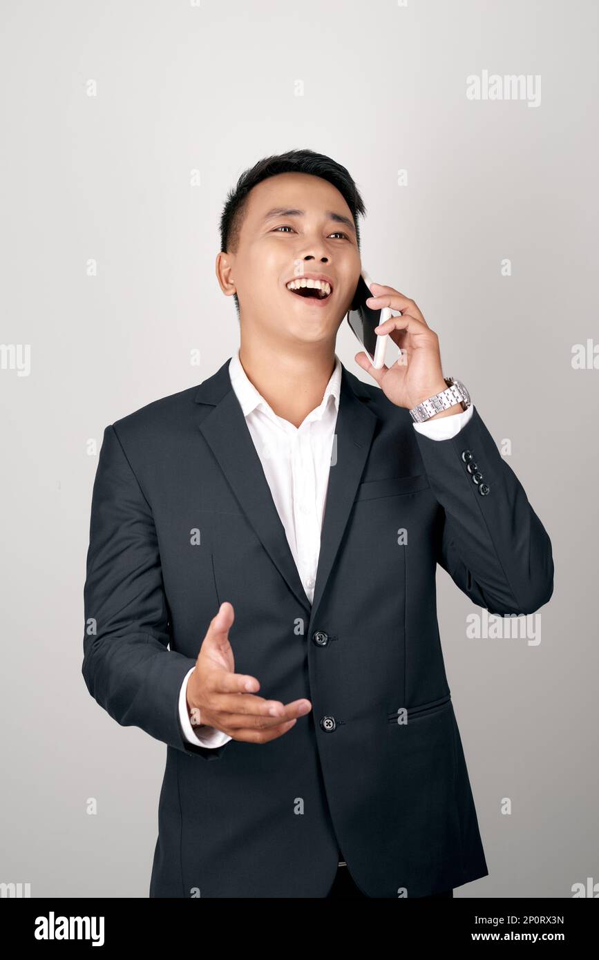 Business man negotiating on phone, isolated on white Stock Photo - Alamy