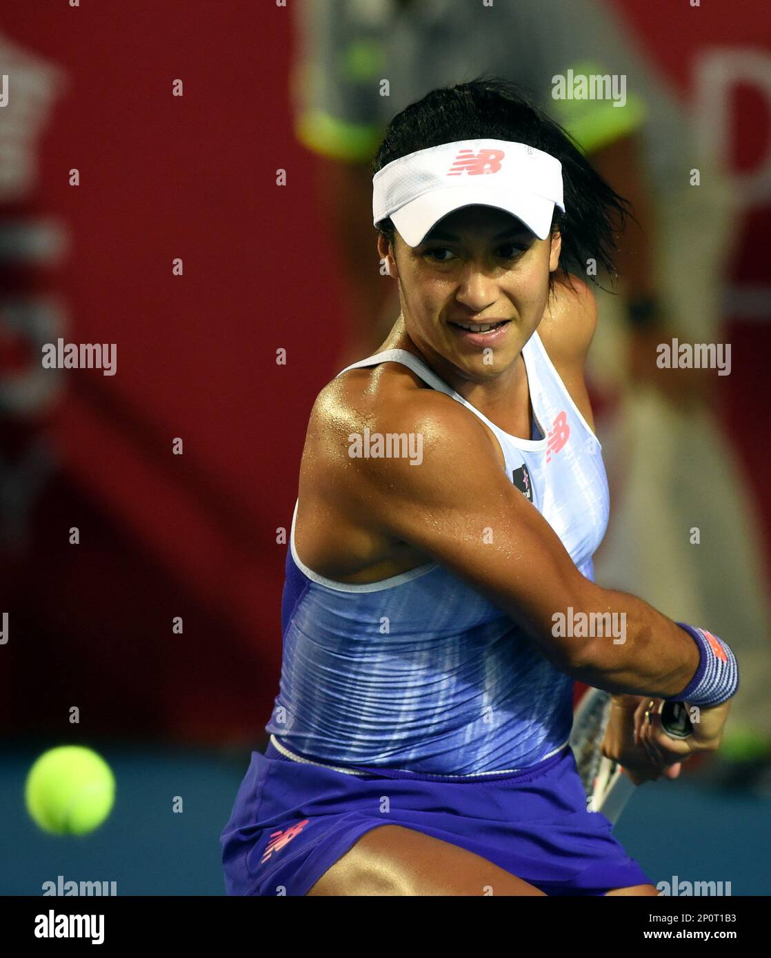 Heather Watson of Great Britain returns a shot to Caroline Wozniacki of ...