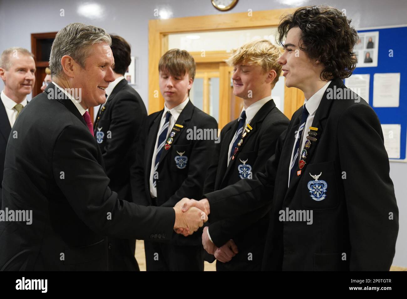 Labour leader Sir Keir Starmer shakes hands with students as he arrives ...