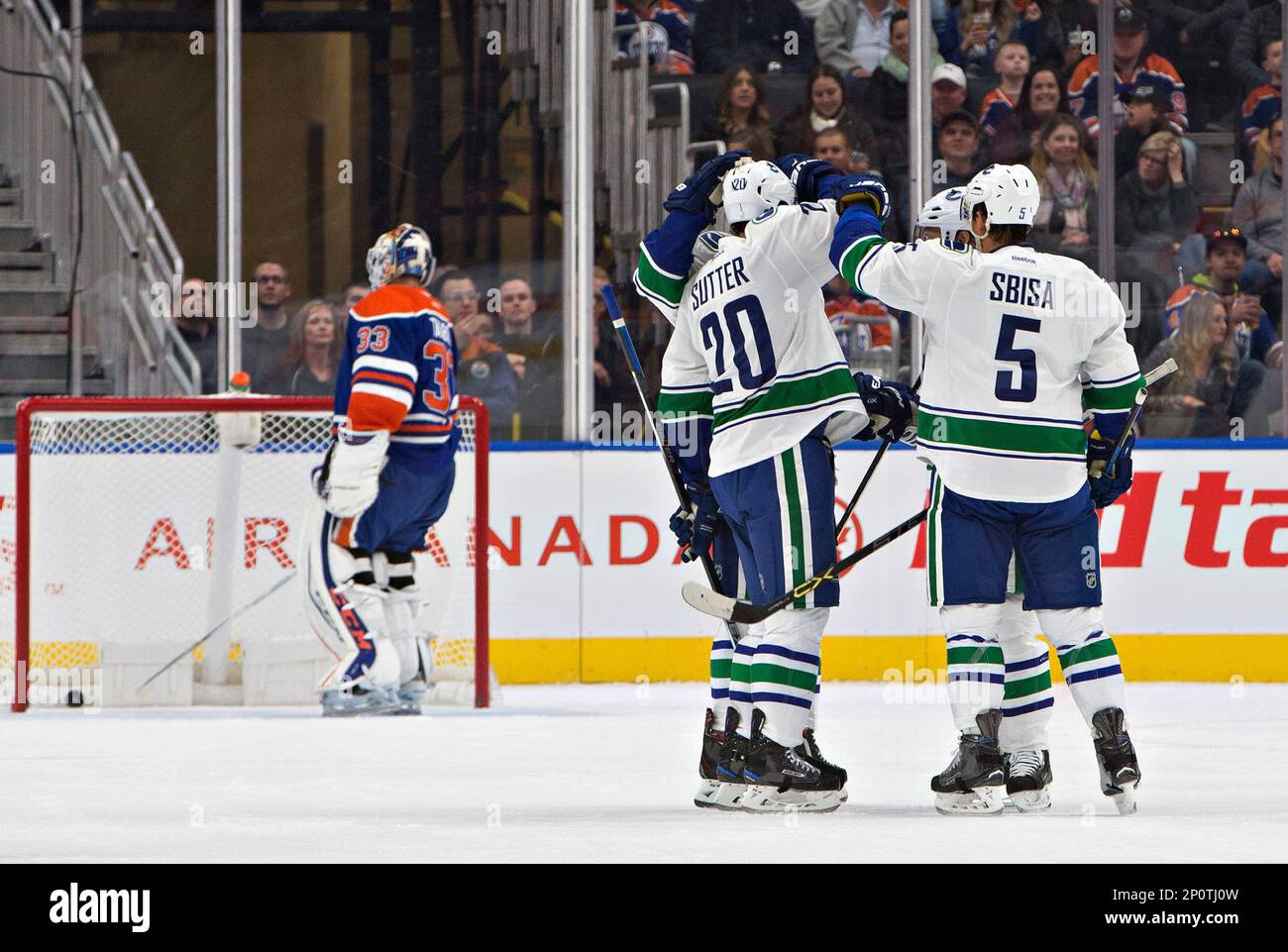 Vancouver Canucks players celebrate a goal against the Edmonton Oilers ...