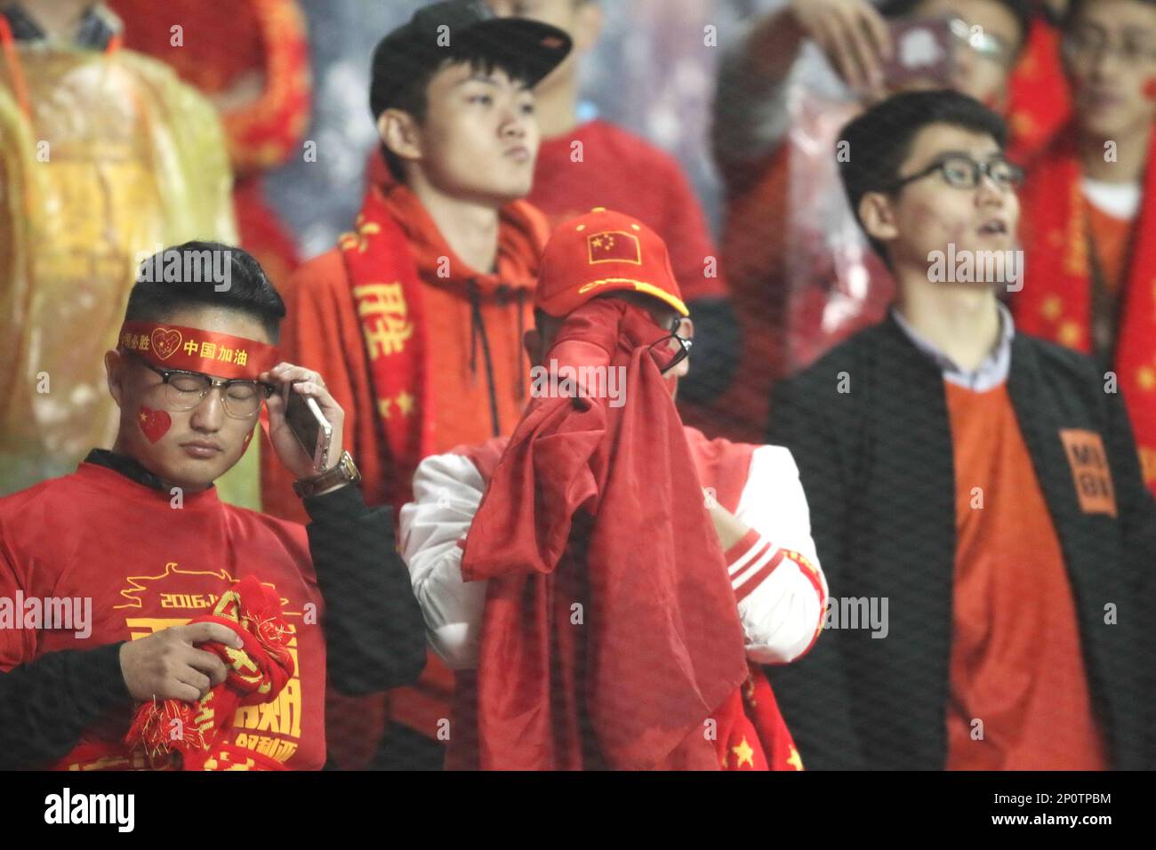 Chinese football fans react after the Chinese national soccer team ...