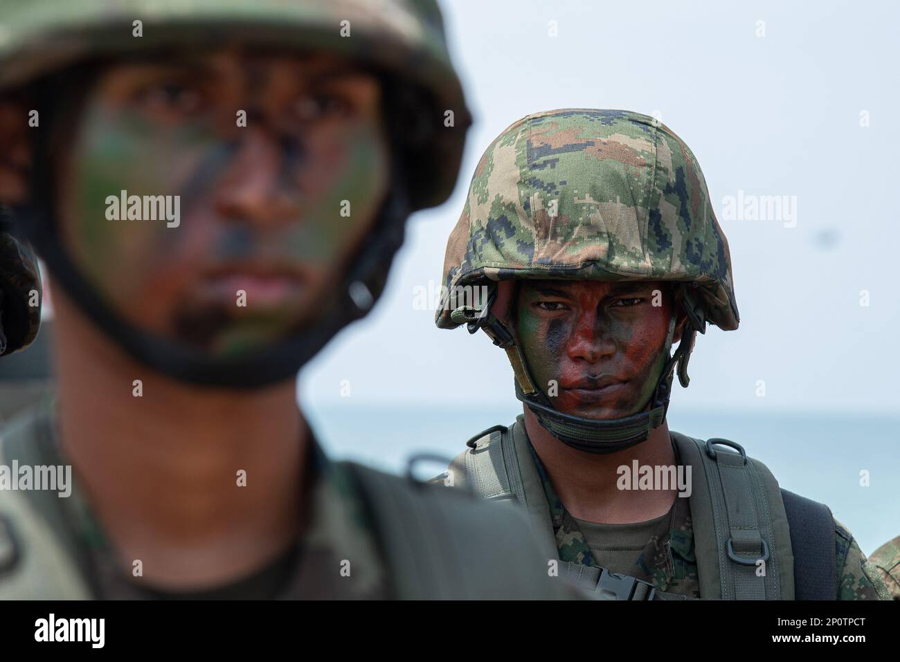 Thai Marines with painted faces participate in an amphibious assault exercise as part of the ...