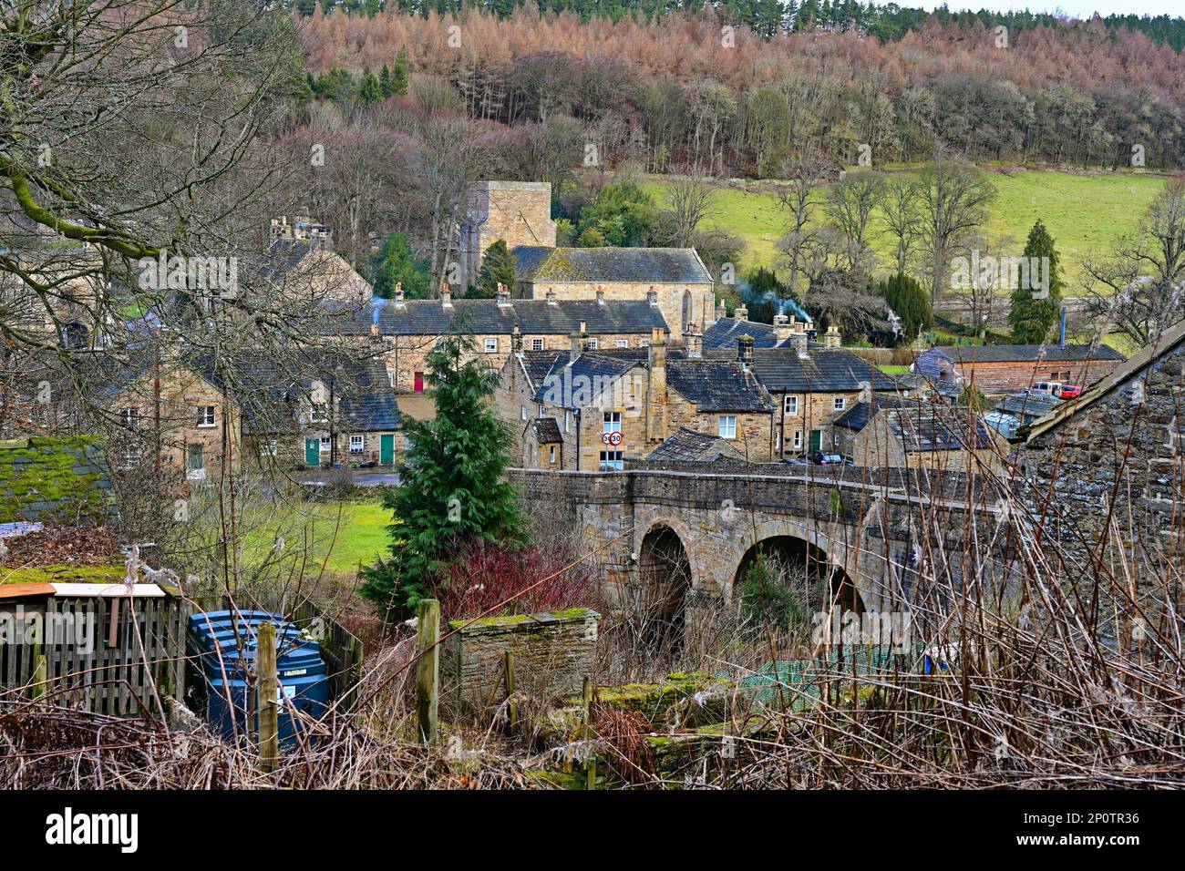 Blanchland village with 12th century church and bridge over the river ...