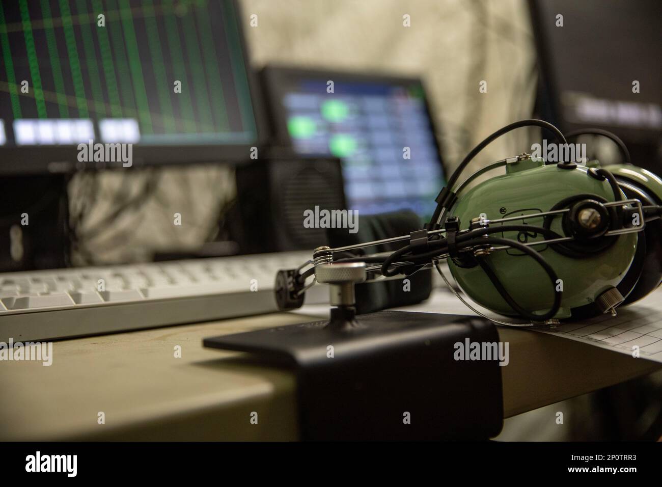 A headset rests by air traffic navigation, integration and coordination ...