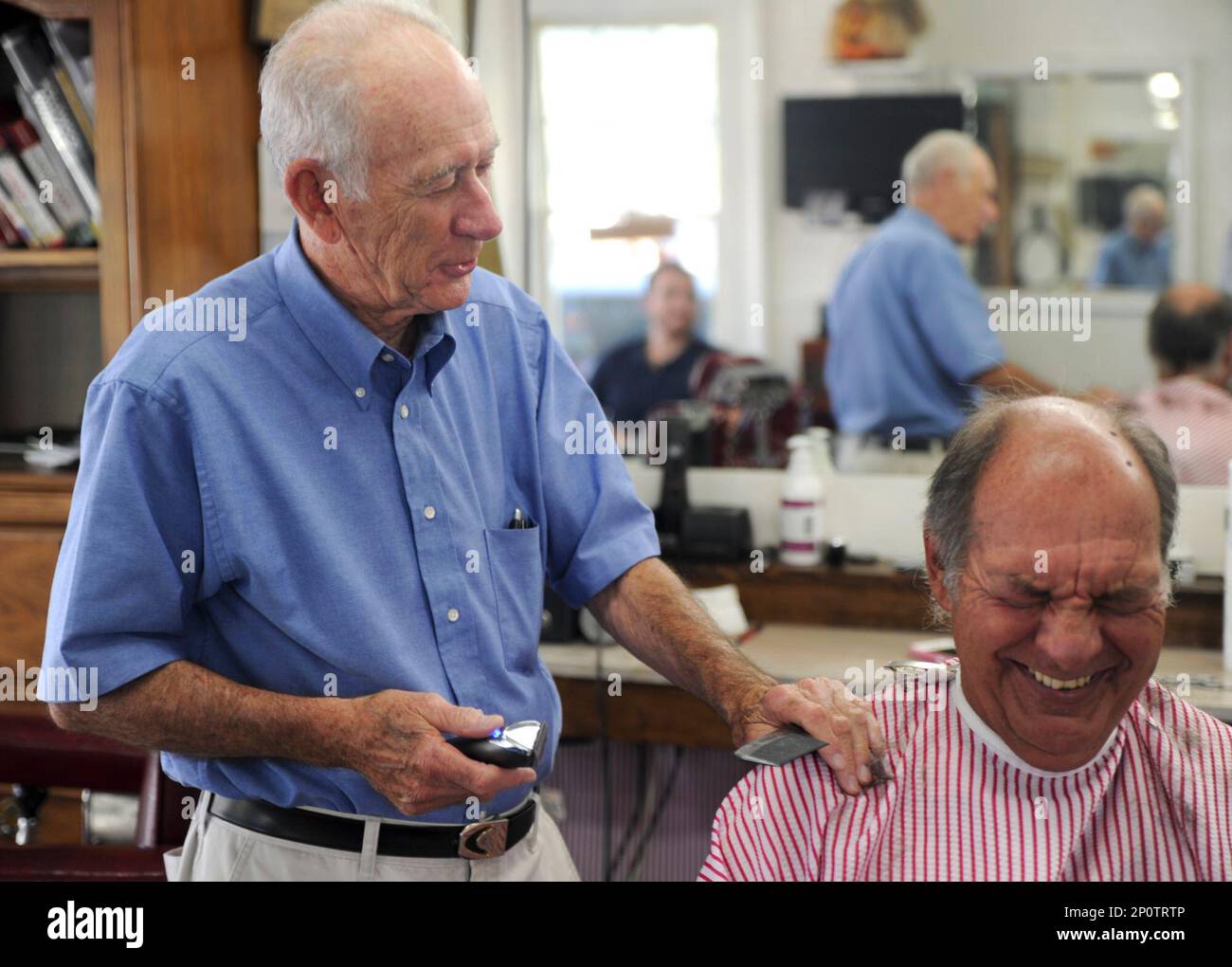 In this Thursday, Sept. 23, 2016 photo, barber Leonard Depsey unleashes ...