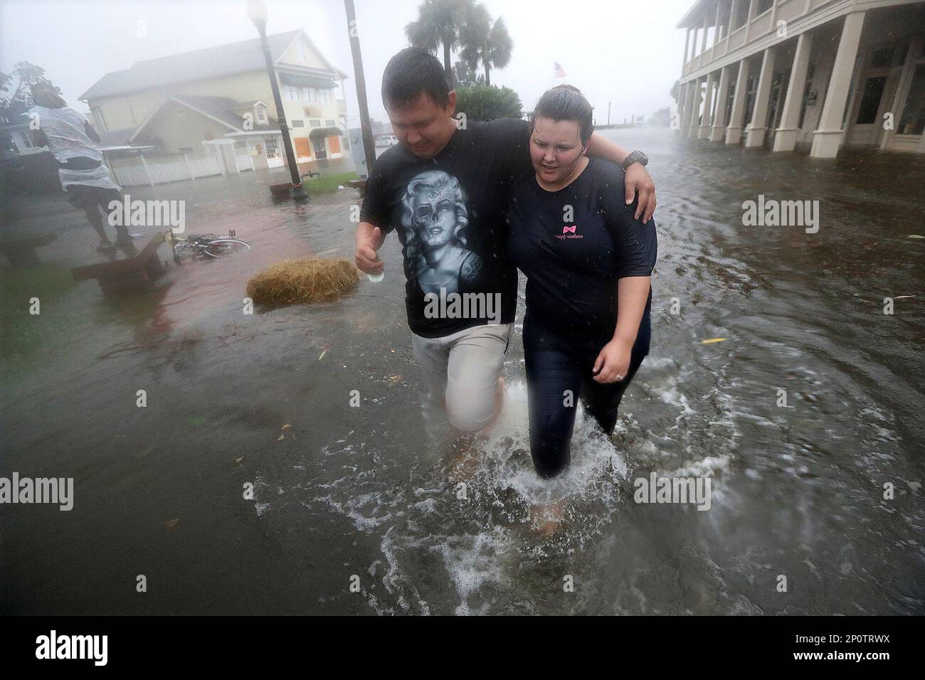 Local residents Michael & Tori Munton make their way through the ...
