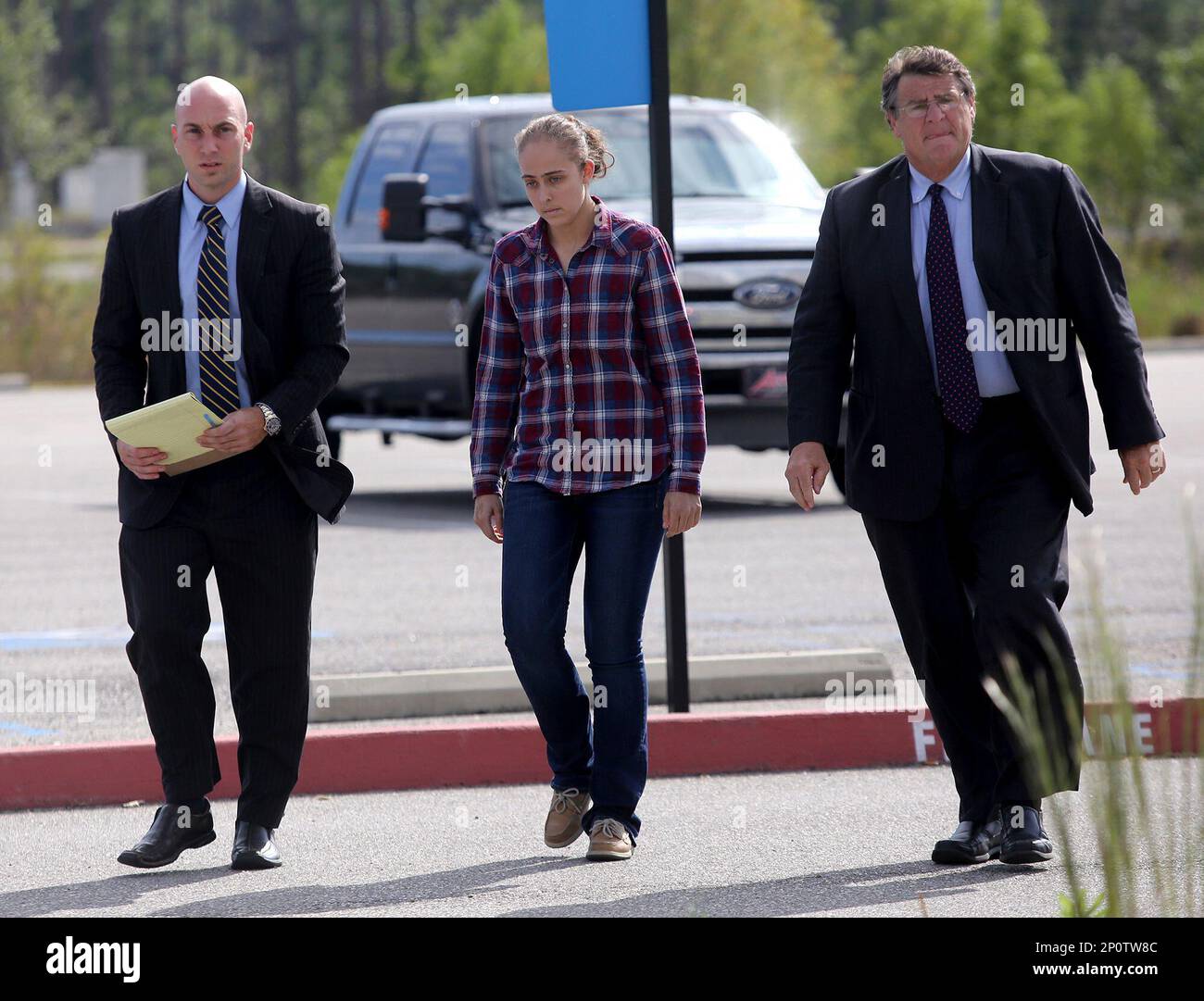 Former Long Beach Police Officer Cassie Barker walks into the Hancock ...