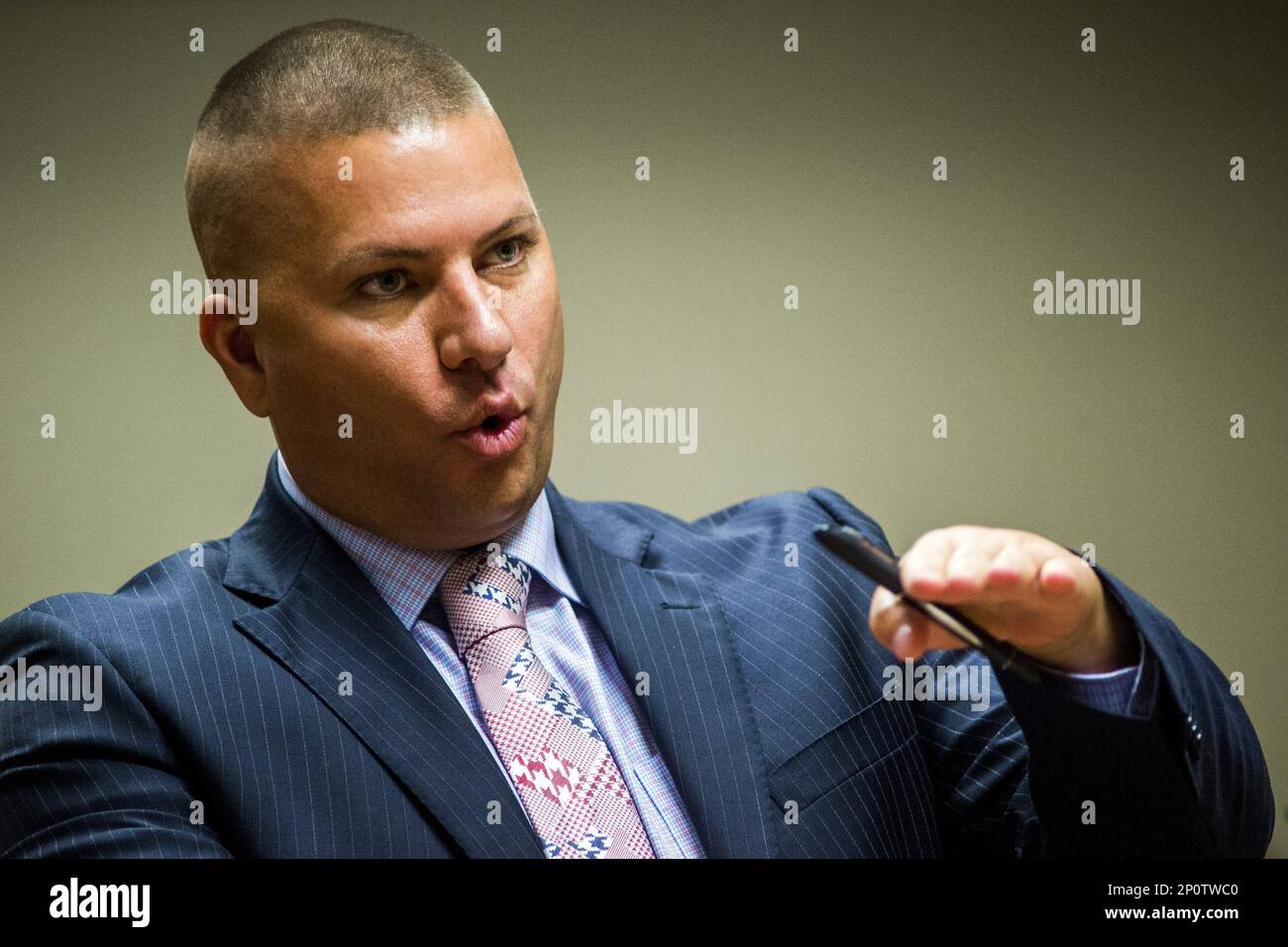 Defense Attorney Justin Henry questions witness Lt. Gerald Hunt during ...
