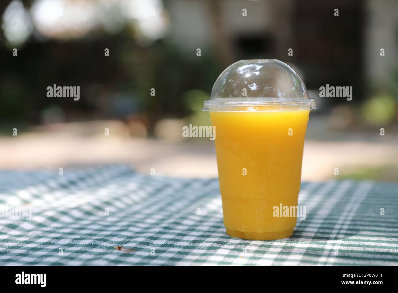 Mango smoothie milk shake with take out glass Stock Photo - Alamy