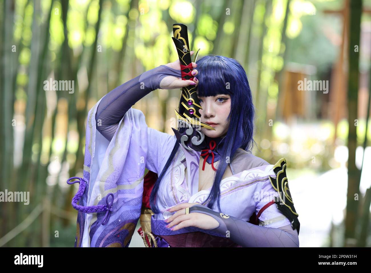 Portrait of a beautiful young woman game cosplay with samurai dress ...