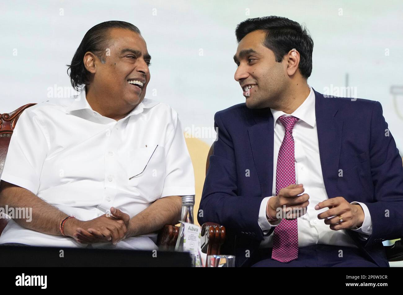 Chairman of Reliance Industries Limited Mukesh Ambani, left, speaks with Chief Executive Officer ...