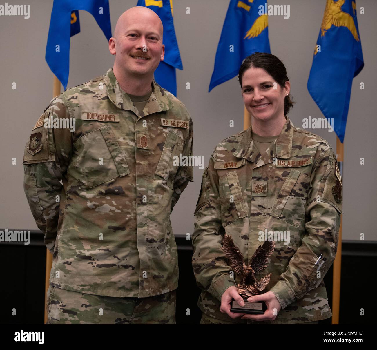 U.S. Air Force Chief Master Sgt. Kyle Hoopingarner, left, command chief ...