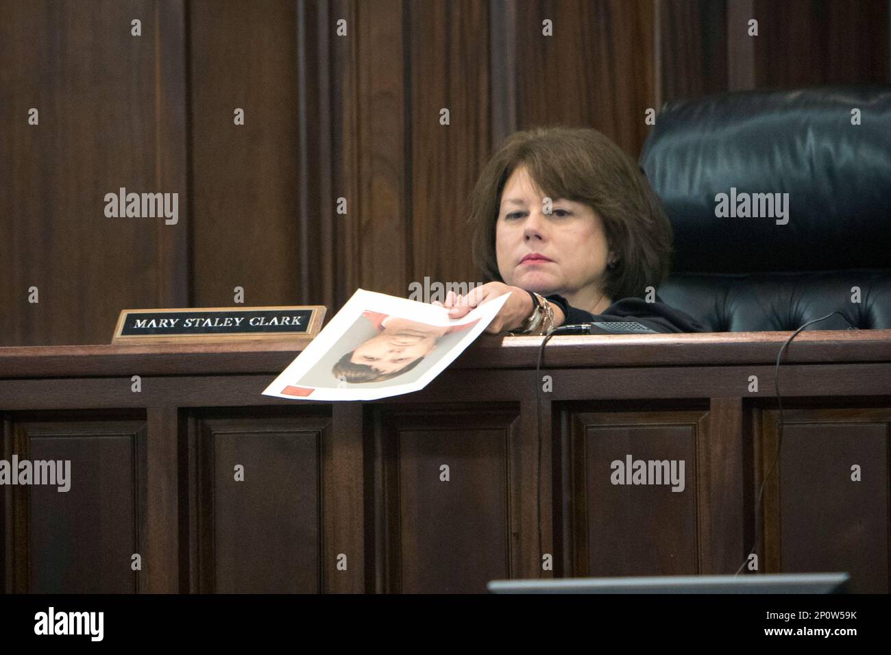 Cobb County Superior Court Judge Mary Staley Clark holds a booking mug ...