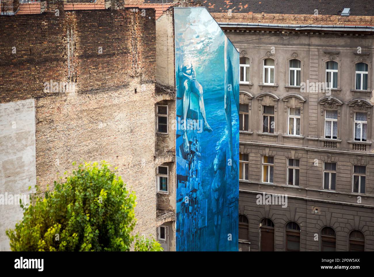 An urban artwork, a mural painted on a firewall of a residental ...