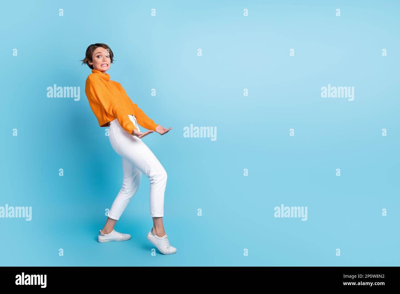 Full length photo of lovely young lady carry hold heavy empty space ...