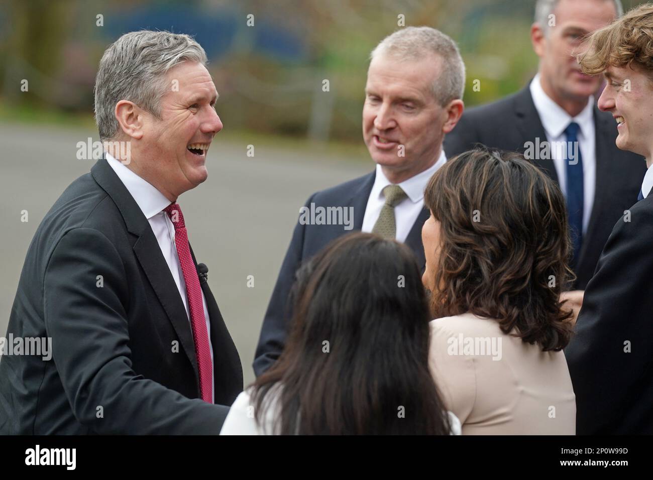 Labour leader Sir Keir Starmer with principal Finbar Madden (centre) as ...