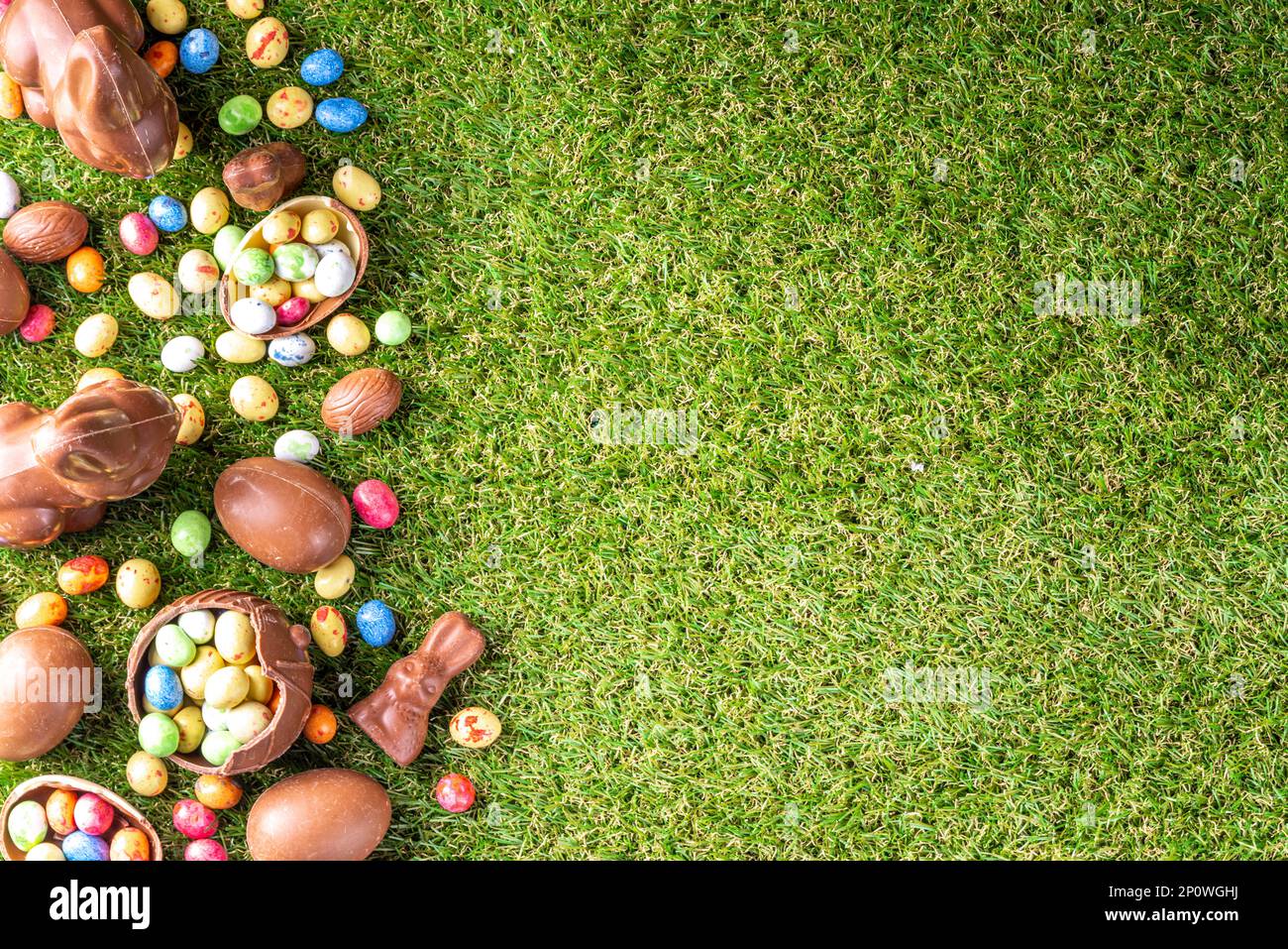 Easter egg hunting background. Various candy and chocolate Easter eggs ...
