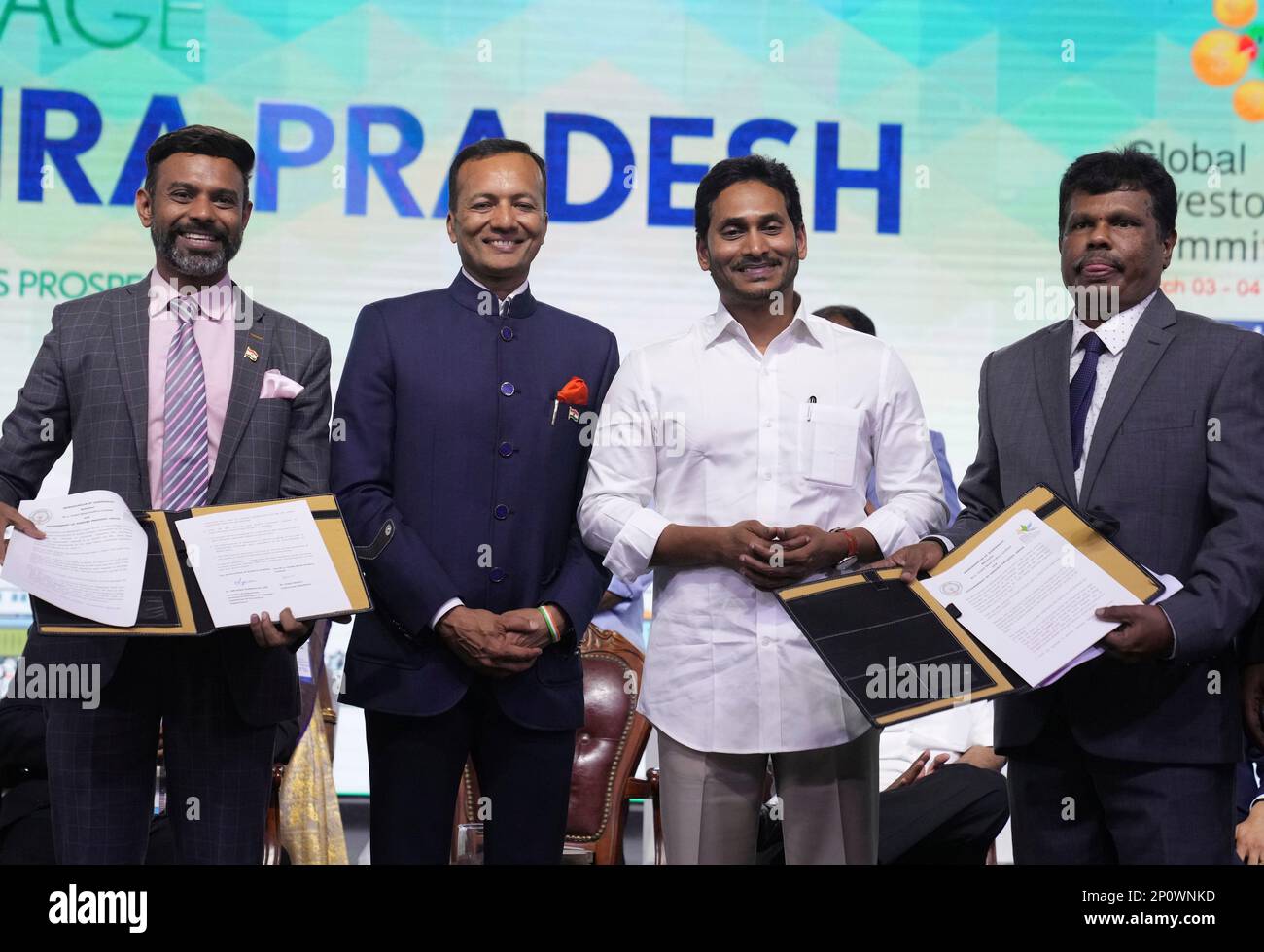 Chief Minister of Andhra Pradesh state Y S Jagan Mohan Reddy, centre right, and Chairman Jindal ...