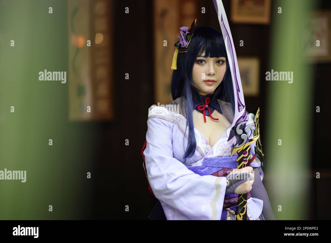 Portrait of a beautiful young woman game cosplay with samurai dress ...