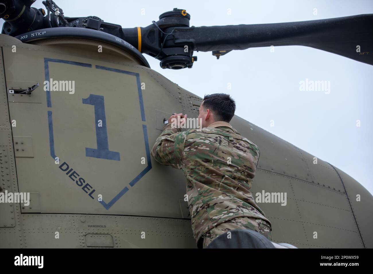 U.S. Army Sgt. Keith Candiano, a CH-47 helicopter mechanic assigned to ...