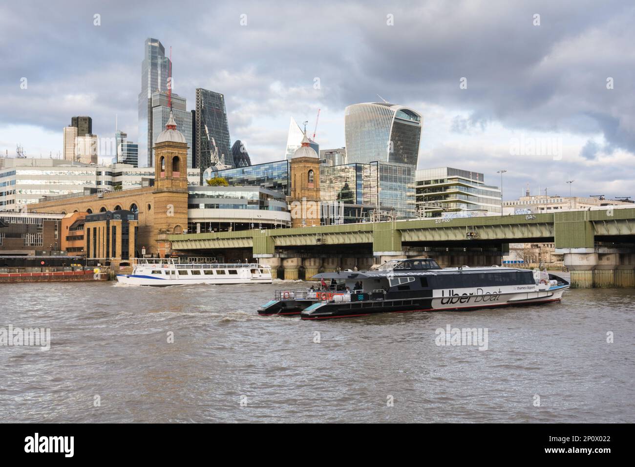 An Uber boat and Cannon Street station and railway bridge, City of ...