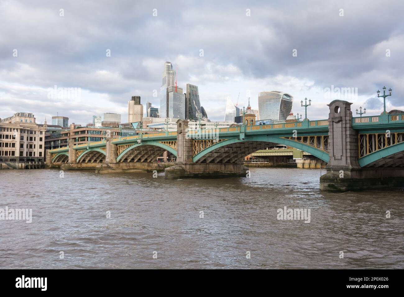 Southwark Bridge spanning the River Thames and the skyscraper riddled ...