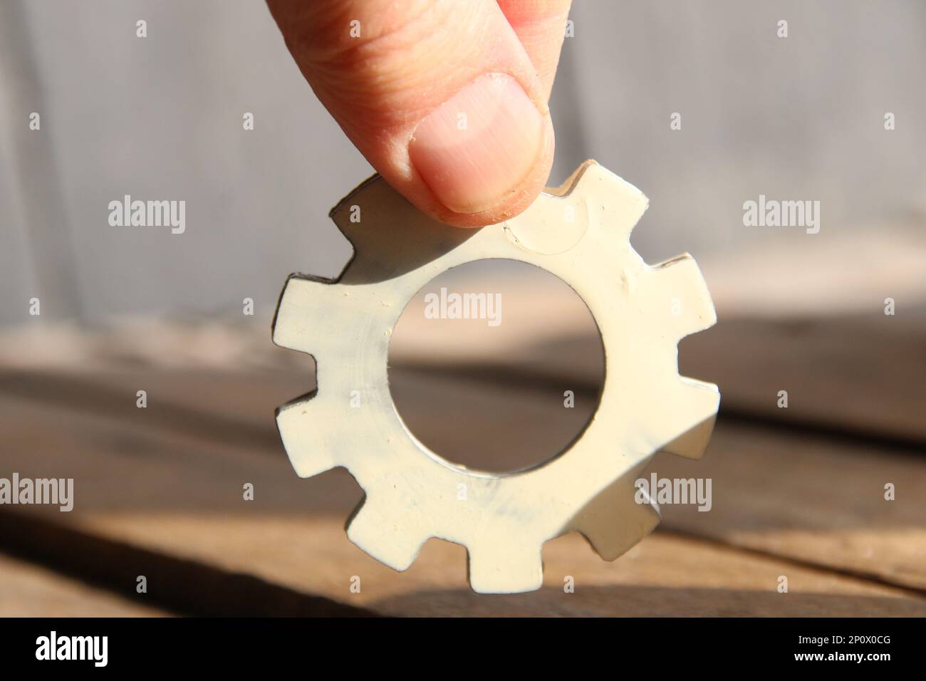 Hand holding a gear. Teamwork, partnership and integration concept ...