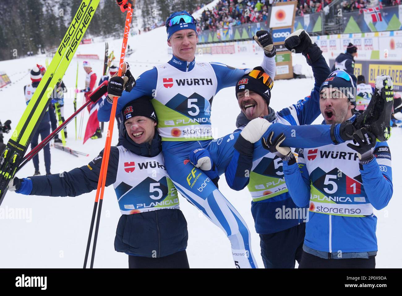Finland's Niko Anttola, top, celebrates with teammates after placing ...